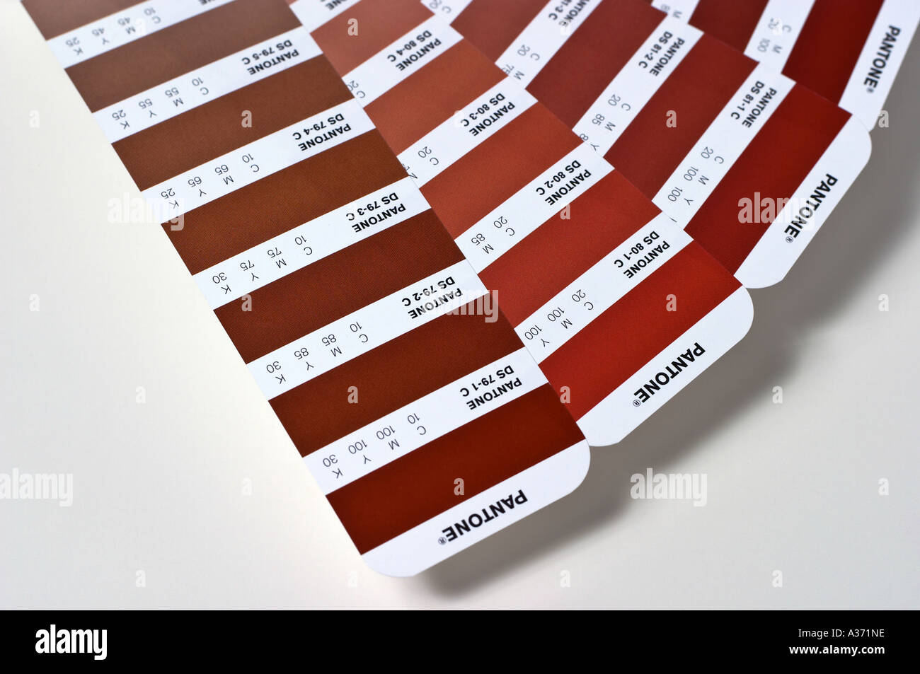 Fanned out red shades of the Pantone color guide Stock Photo - Alamy