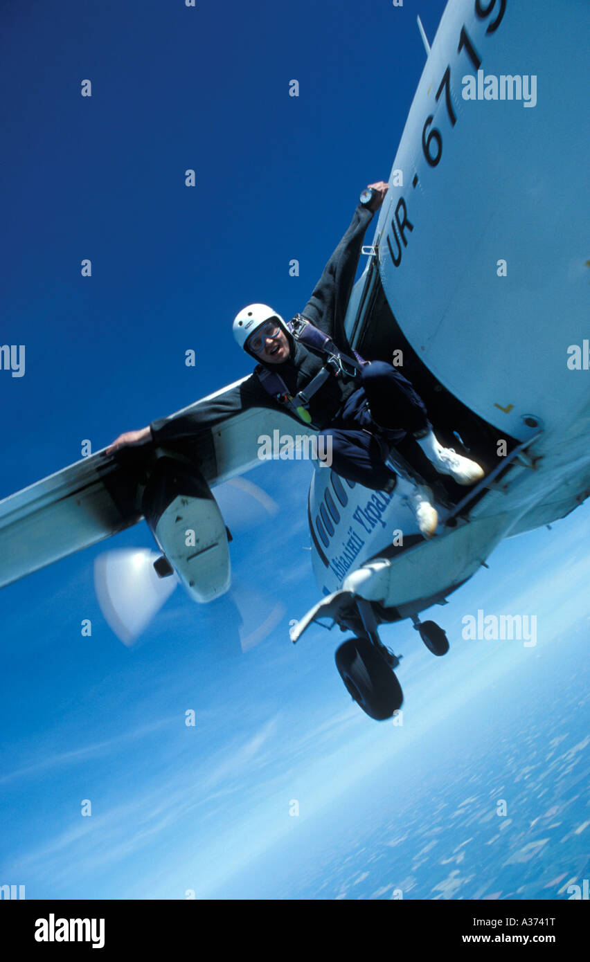 Sky diver leaping from the small plane Stock Photo - Alamy