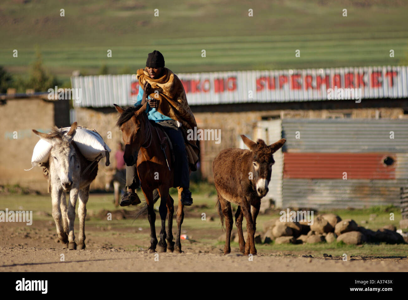 A Basotho man on horseback in the village of Semonkong in Lesotho Stock ...