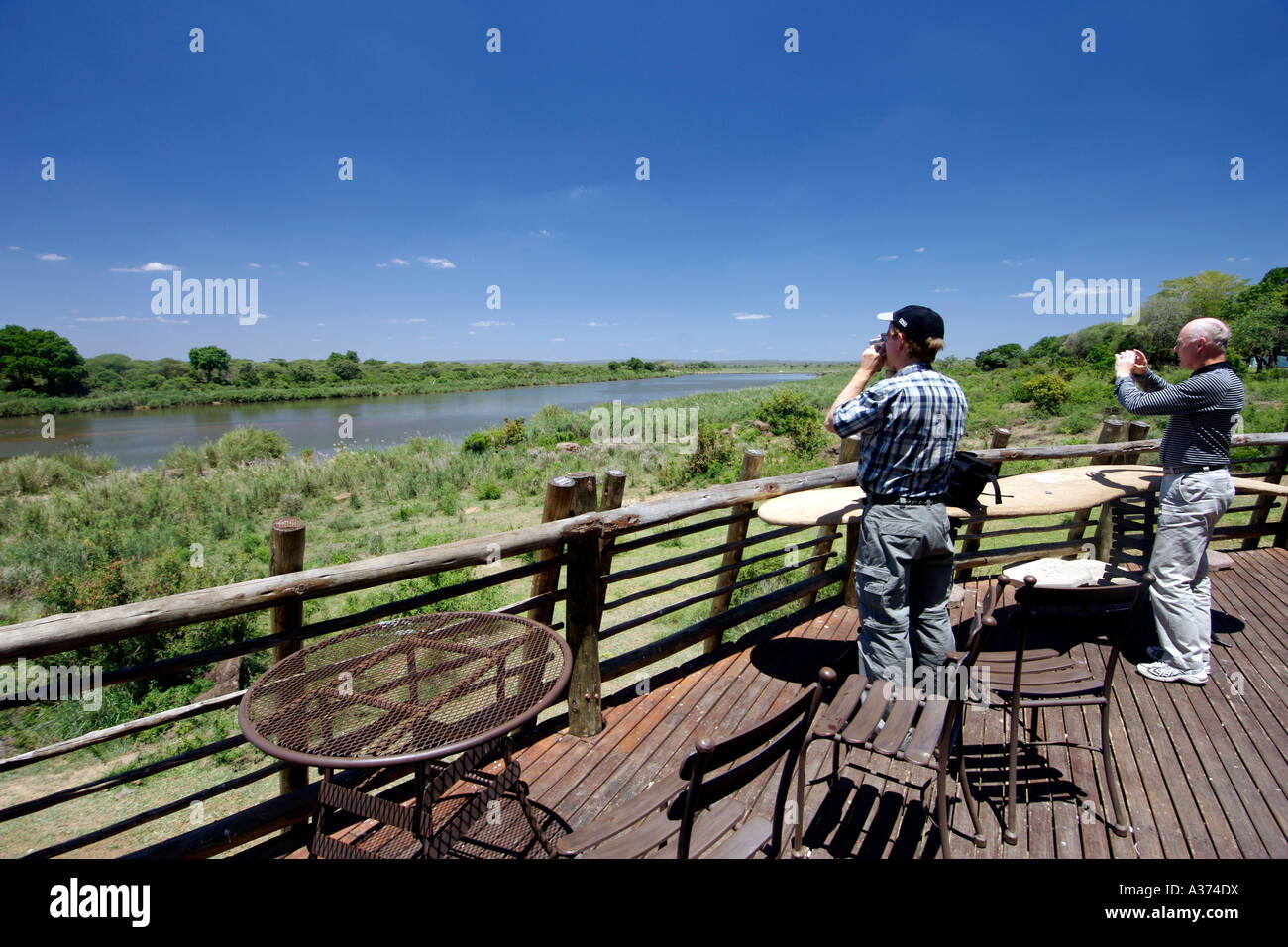 Tourists on the viewing deck of the Lower Sabie camp overlooking the ...