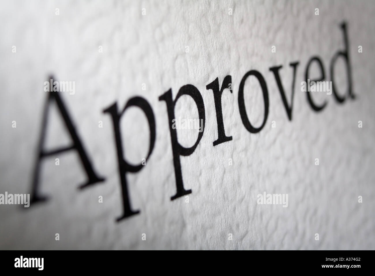 the word approved printed on to texture paper Stock Photo - Alamy