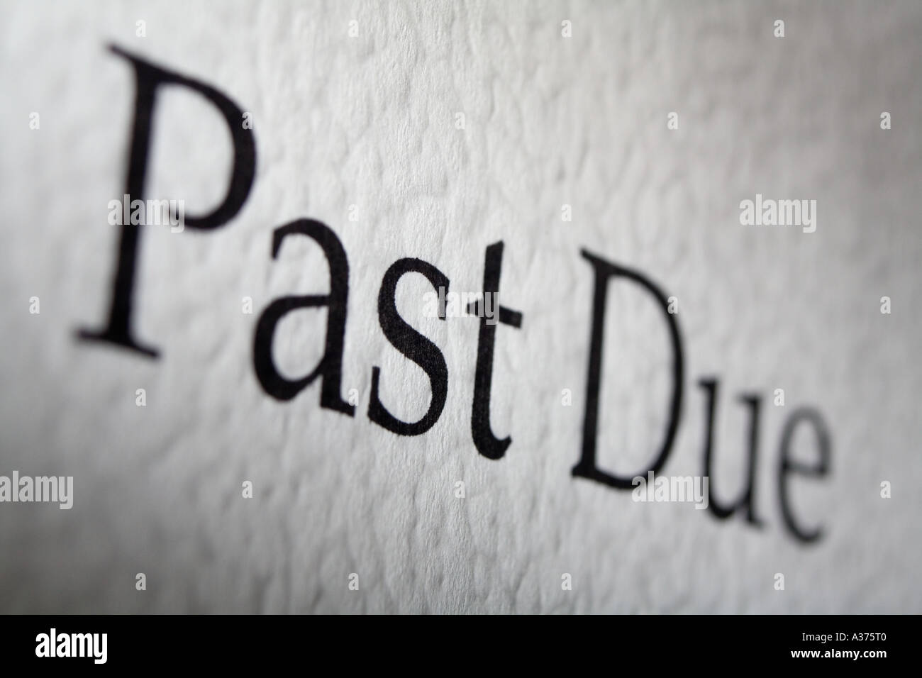 the word past due printed on to texture paper Stock Photo - Alamy