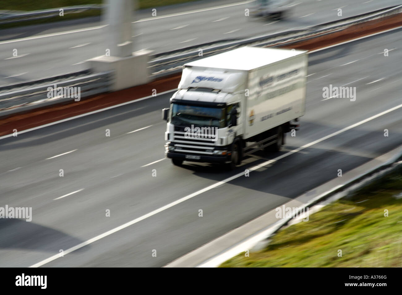 Delivery Truck on Motorway England Blurred Stock Photo - Alamy