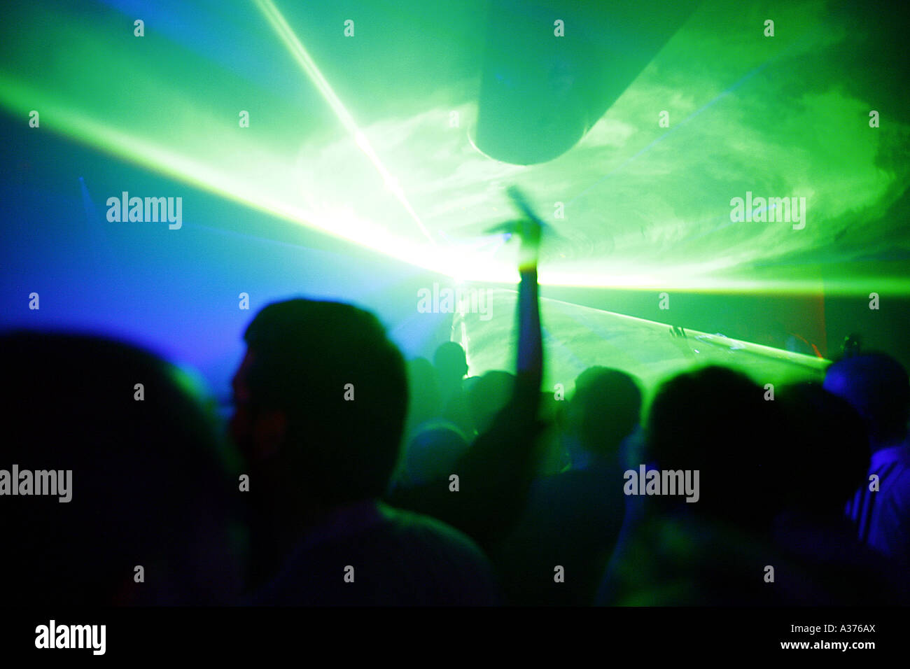 reaching for lazers at nightclub Stock Photo - Alamy