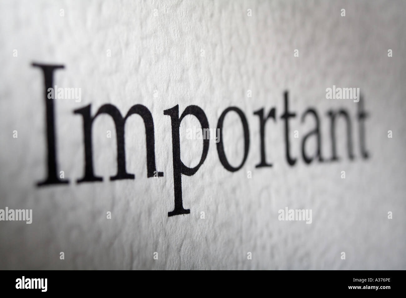the word important printed on to texture paper Stock Photo - Alamy