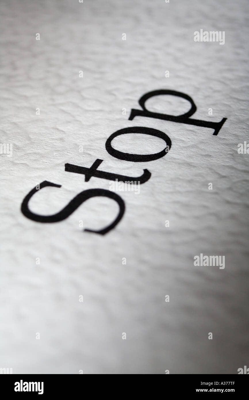 the word stop printed on to texture paper Stock Photo - Alamy