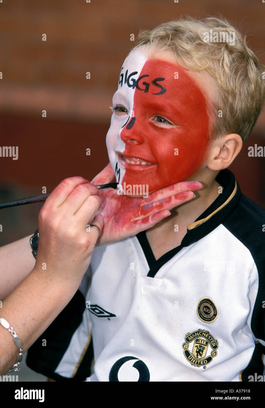Old trafford fans before hi-res stock photography and images - Alamy