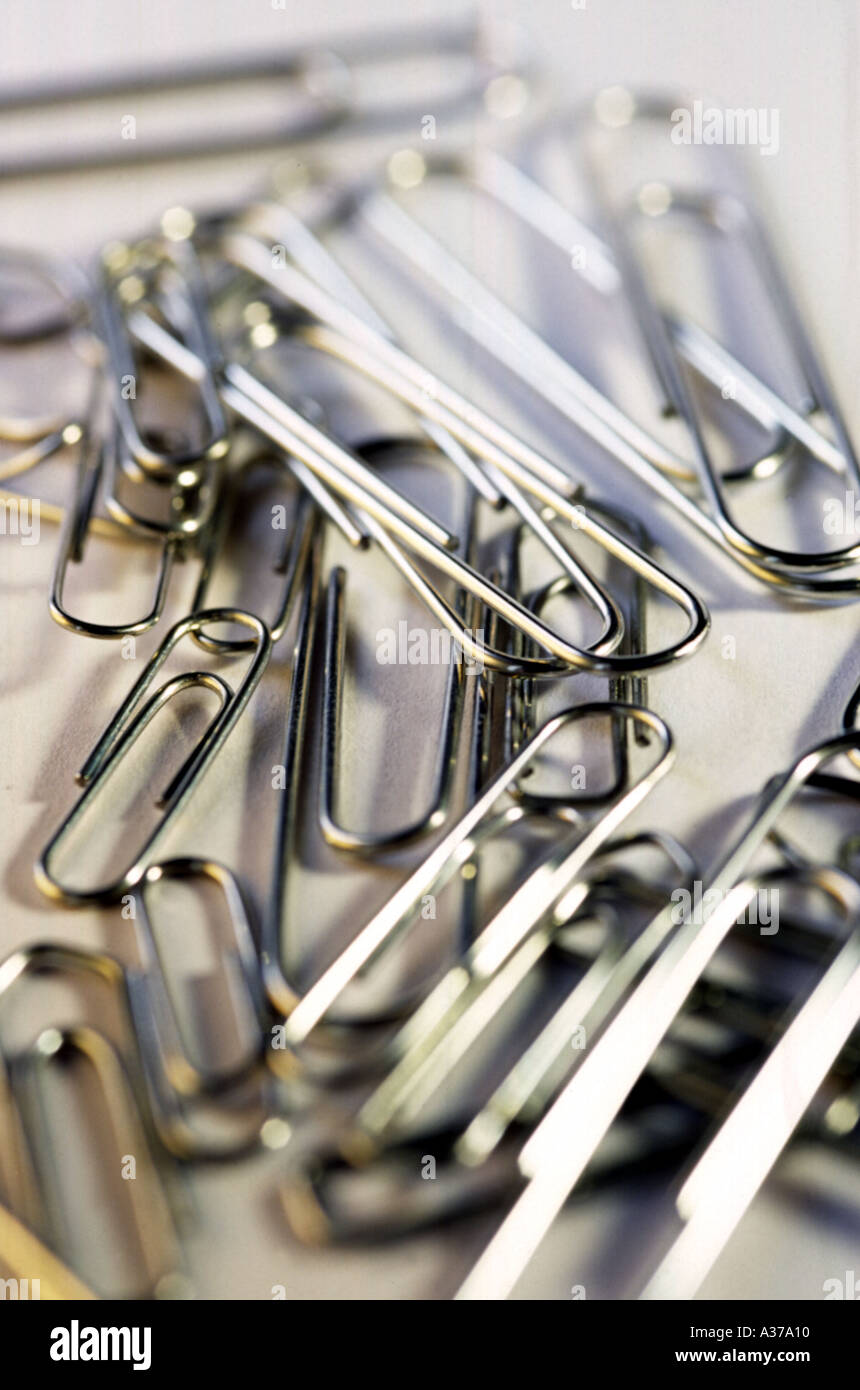 Paper Clips on white coloured background Stock Photo - Alamy