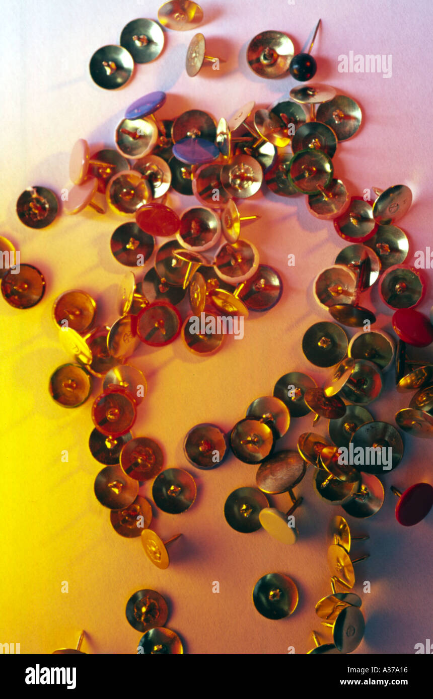 Drawing pins on coloured background Stock Photo - Alamy