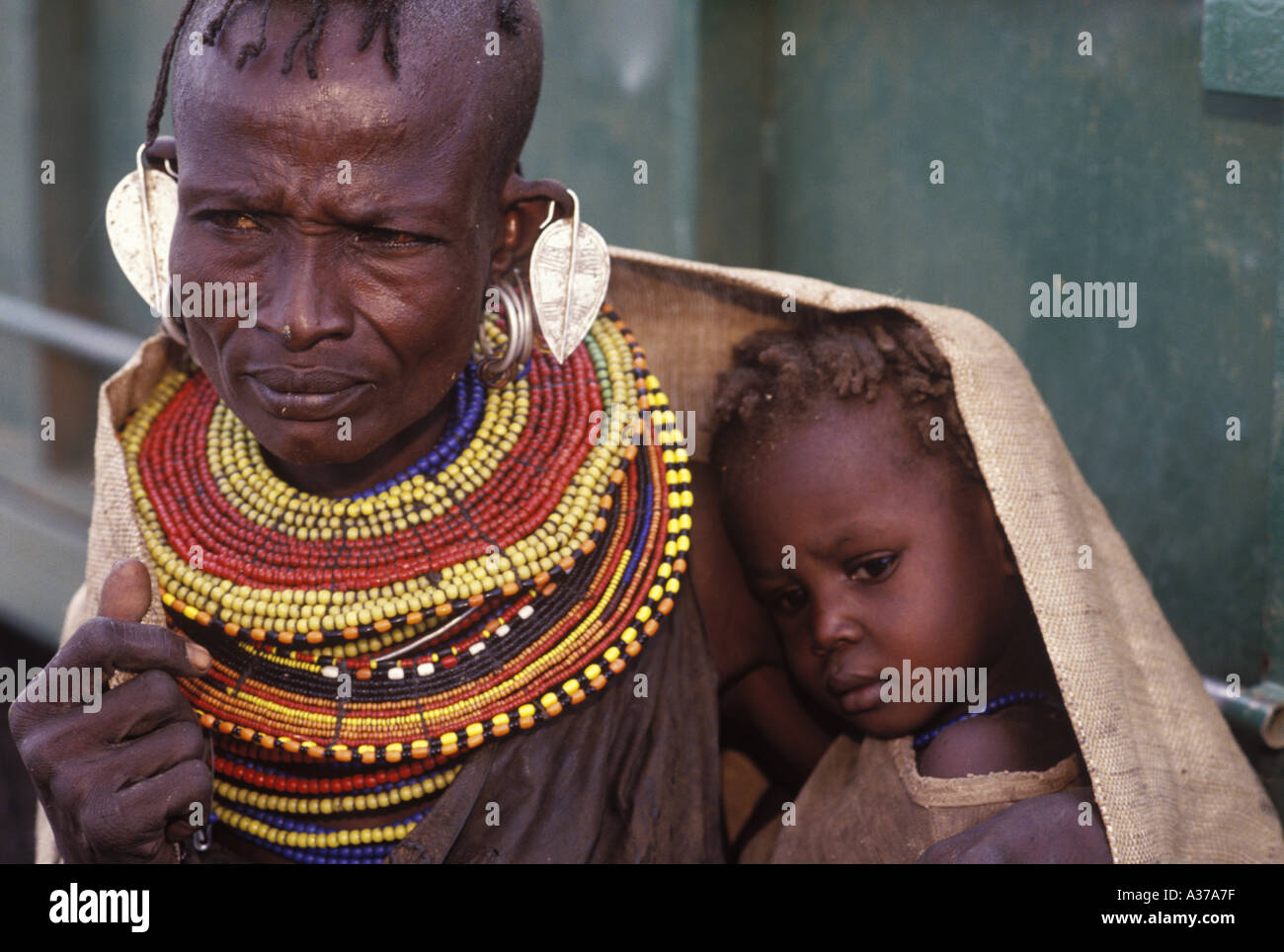 A Turkana mother and child wait for famine relief on the edge of the ...