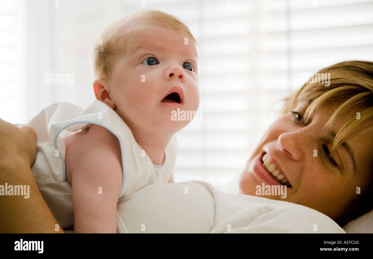 Mother holding child on her chest Stock Photo - Alamy