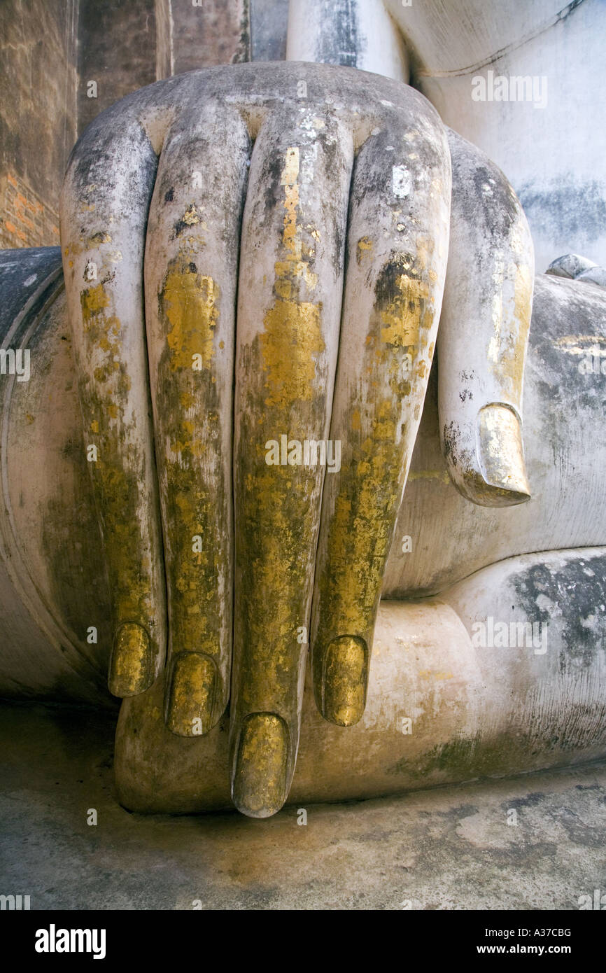 Stone right hand of meditating buddha covered with gold leaf Stock ...