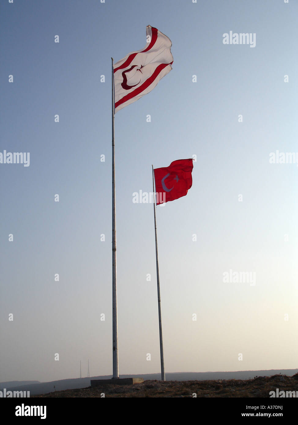 Two flags of Turkish North Cyprus flying at the tip of the Karpas ...