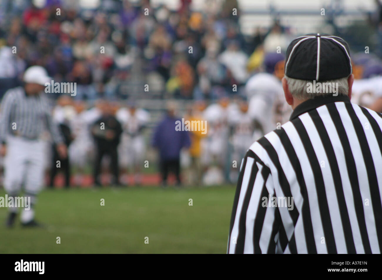 A referee keeping an eye on the play Stock Photo - Alamy