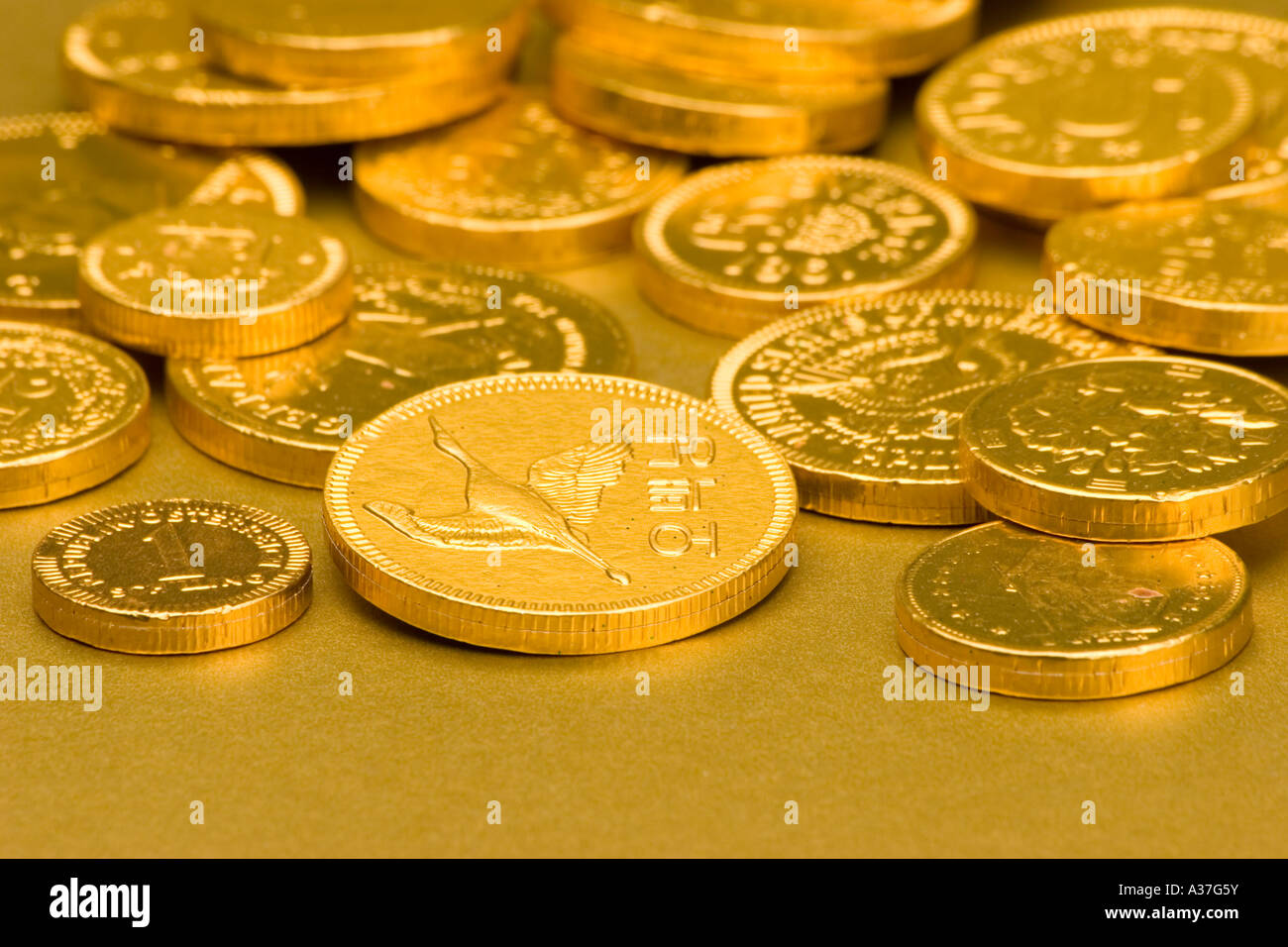 Gold Chocolate coins Stock Photo - Alamy