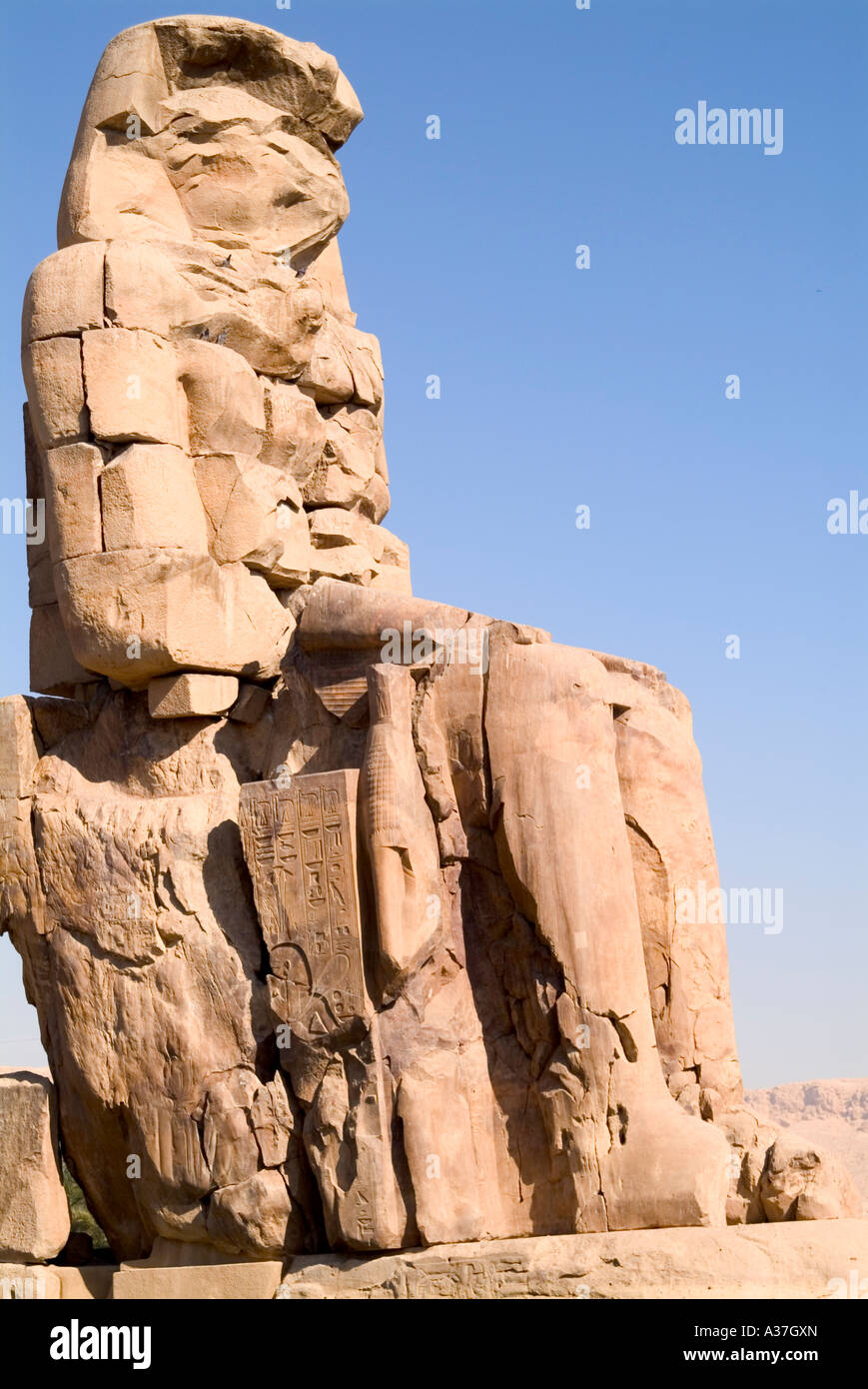 Colossi of Memmon remains of mortuary temple of Amenophis III guarding ...