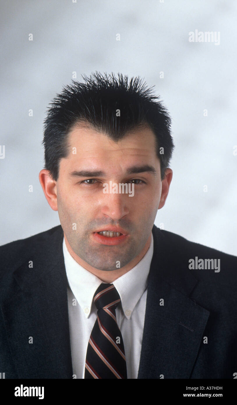 Businessman looking aggressive or angry Stock Photo - Alamy