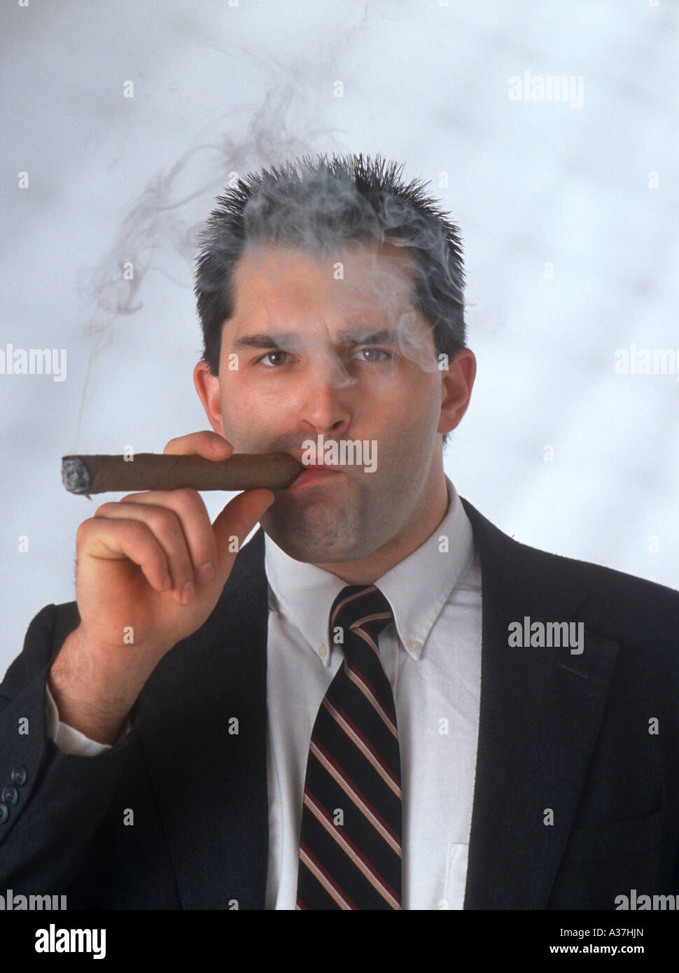 businessman smoking cigar Stock Photo - Alamy