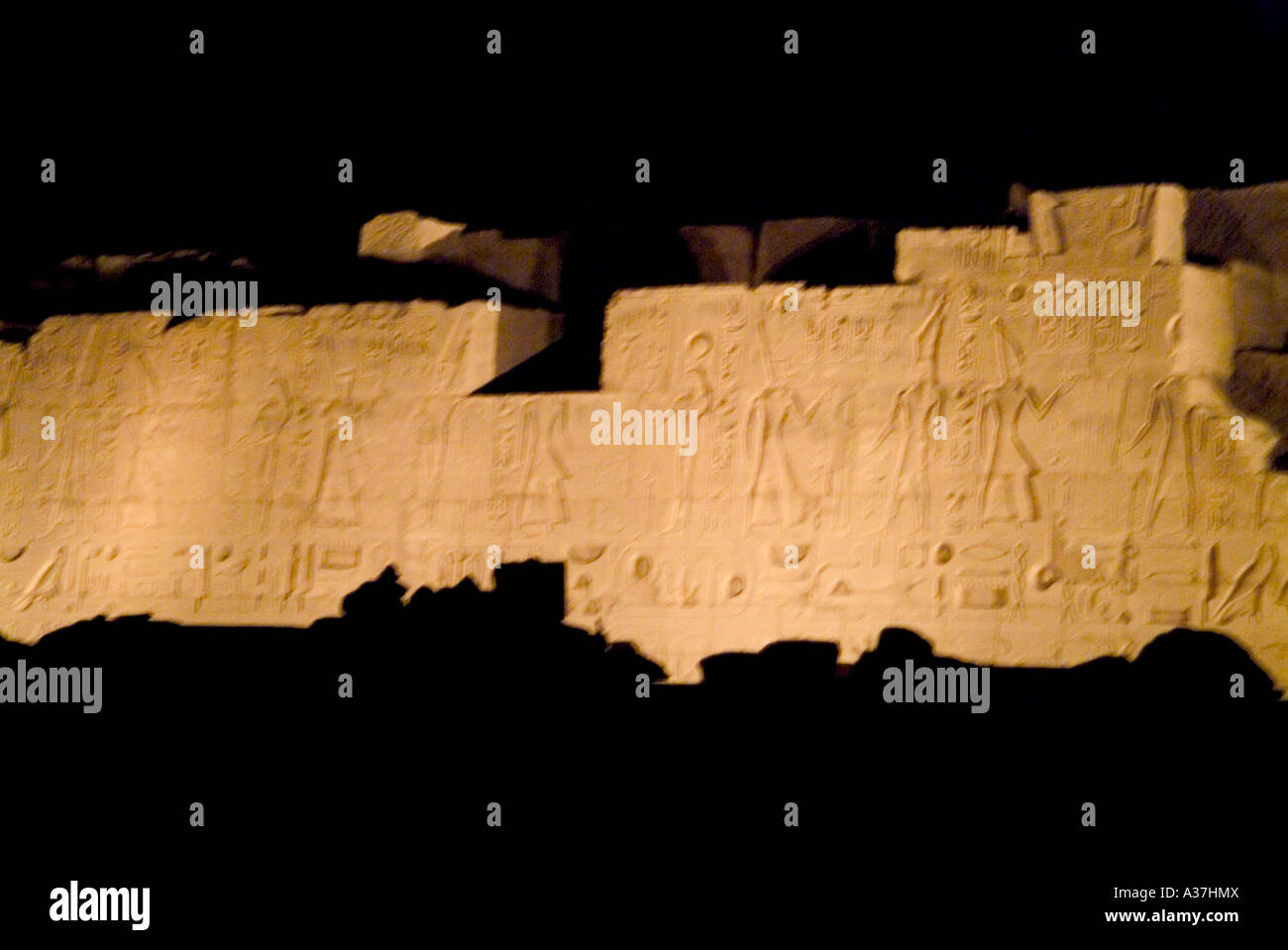 Karnak Temple wall lit Sound and Light Spectacle evening visitors walk ...