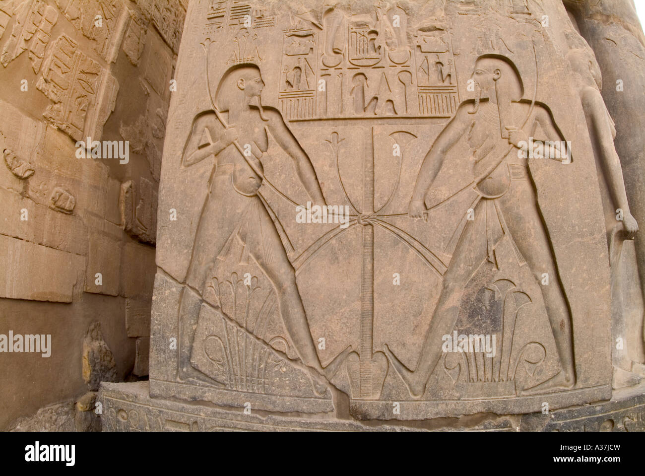 Luxor Temple Thebes hieroglyphics figures colossal statue pharaoh side ...