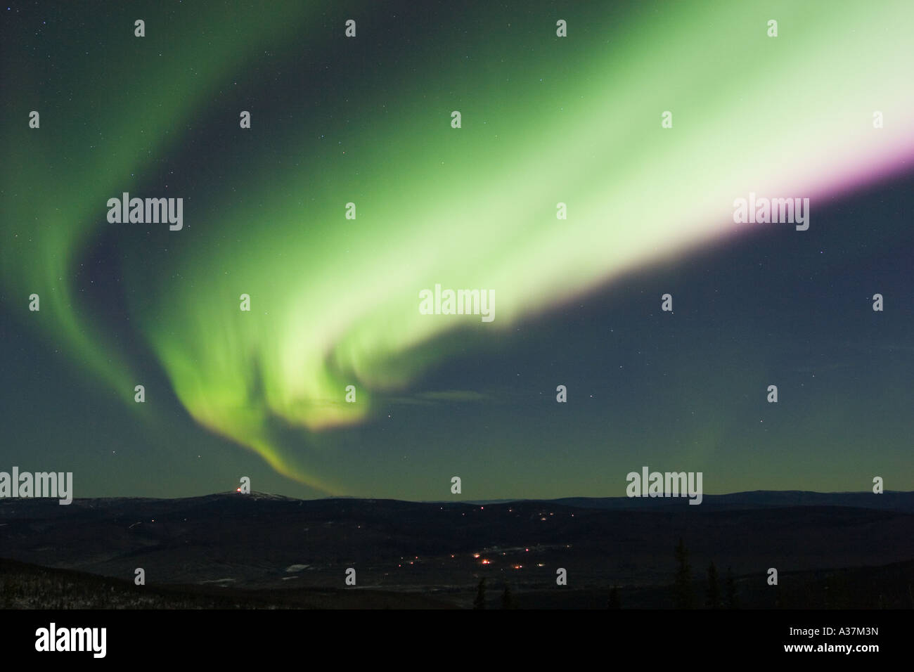 Colorful band of northern lights in the night sky Stock Photo - Alamy