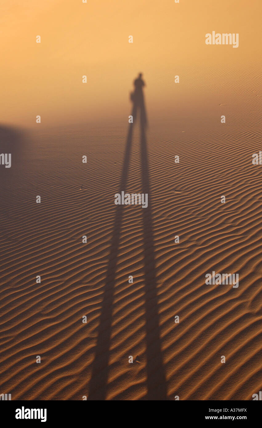 Human shadow in the sand dunes of Erg Chebbi in the Sahara Desert ...