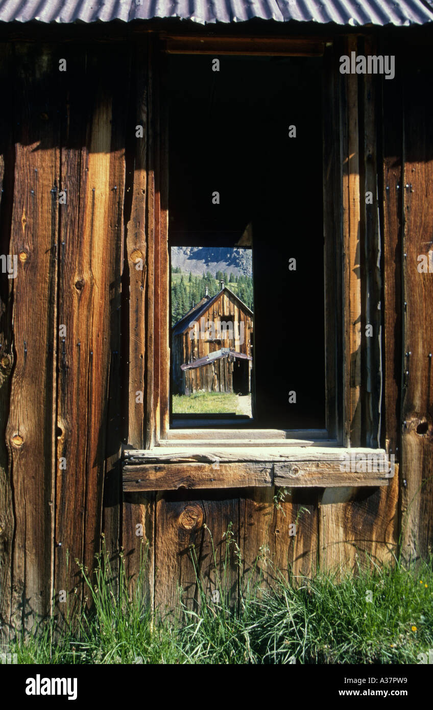 COLORADO Near Ouray Abandoned wooden mine buildings look through window ...