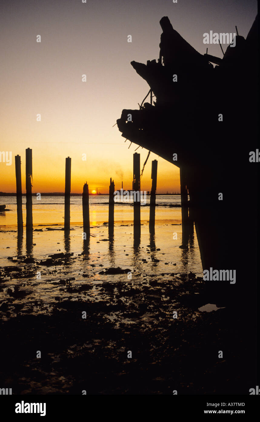 Rotting hull of old sailing ship at silhouette at sunset Stock Photo ...