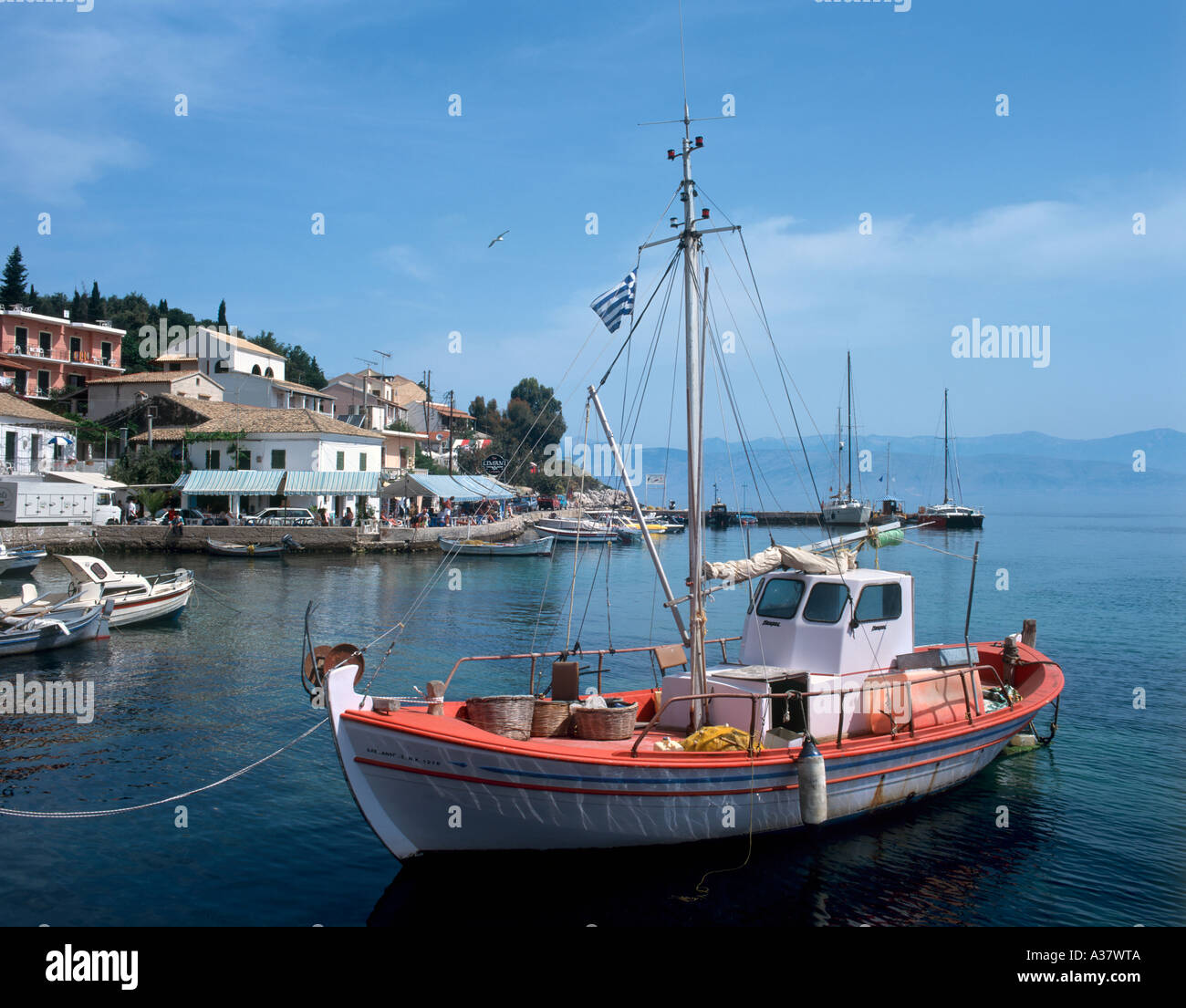 Traditional fishing boat in Kassiopi Harbour, North East Coast, Corfu ...