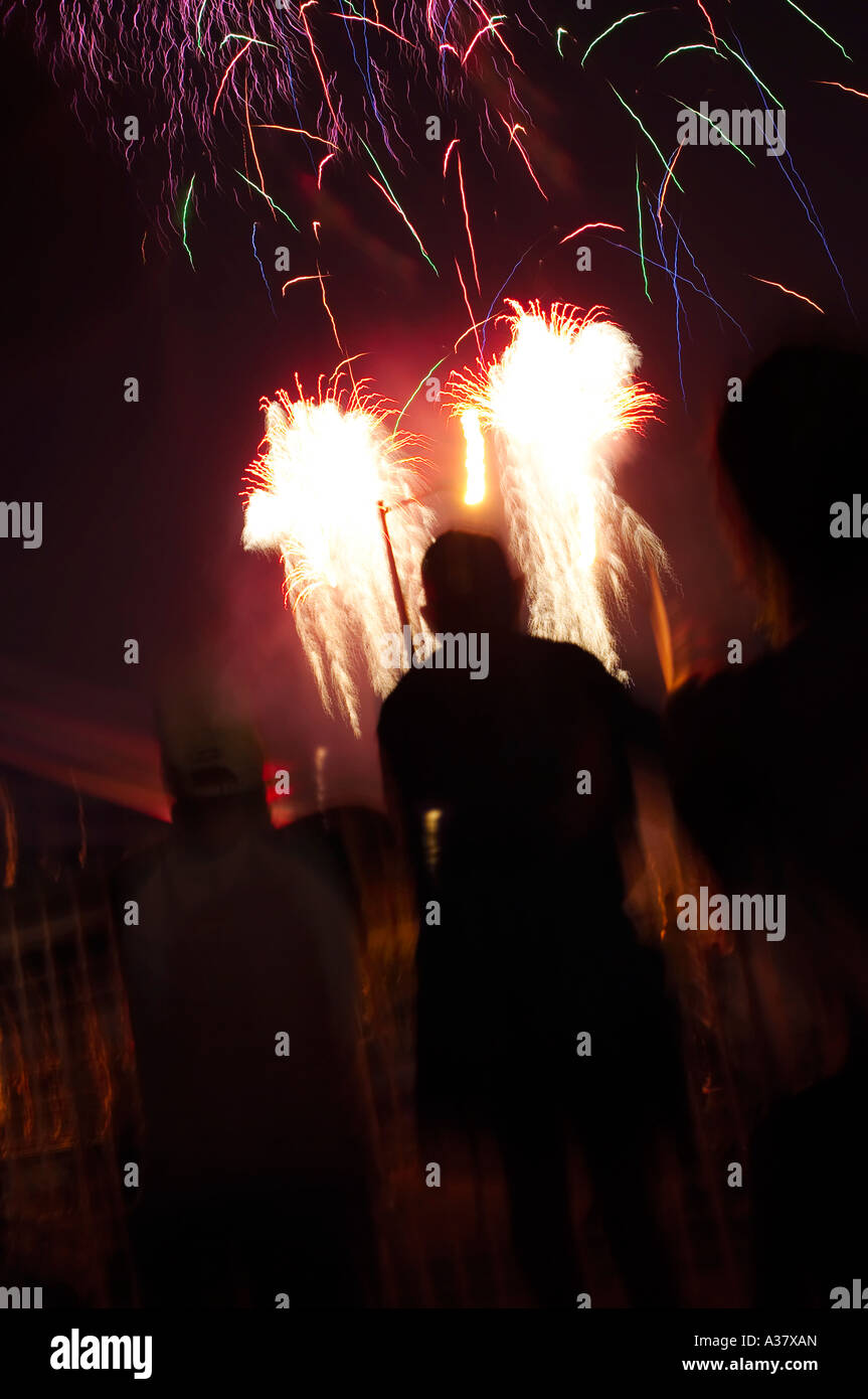 People in a crowd watching fireworks on July 4 Stock Photo - Alamy