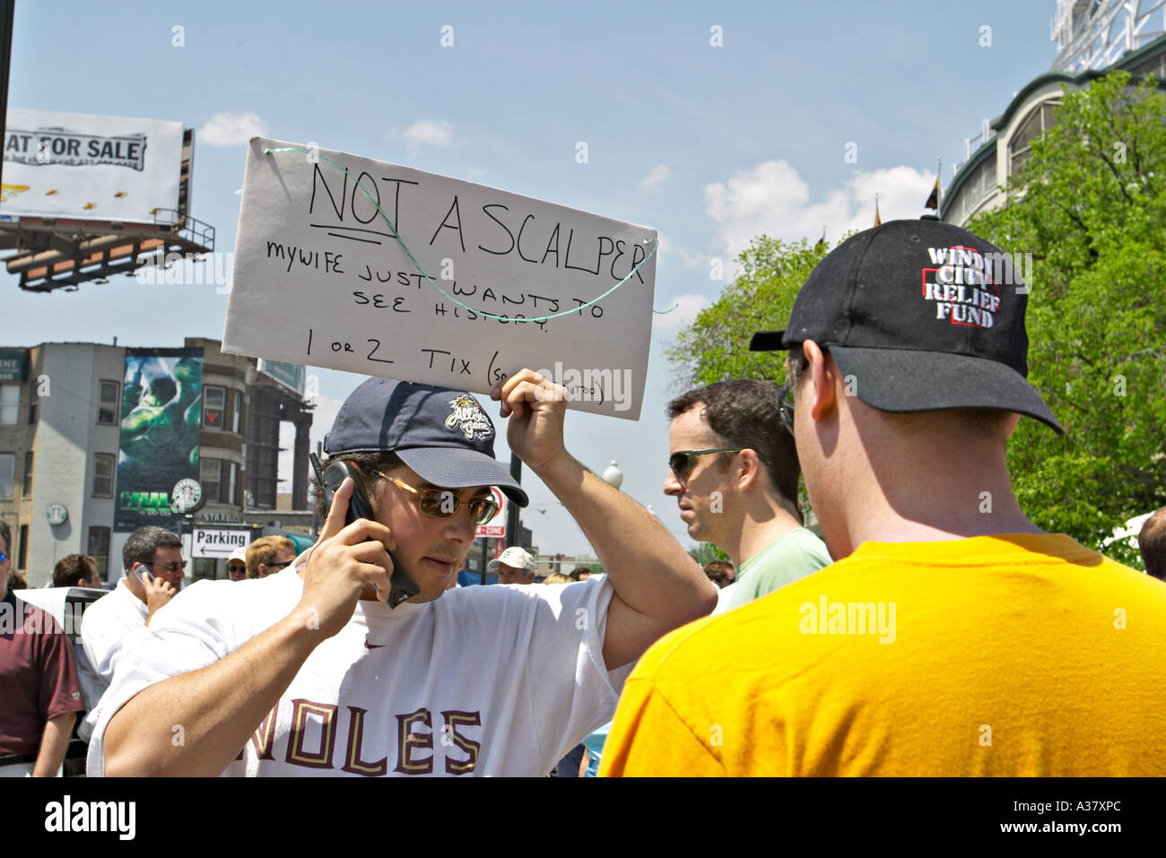 BASEBALL Chicago Illinois Fan talking on cell phone holding sign ...
