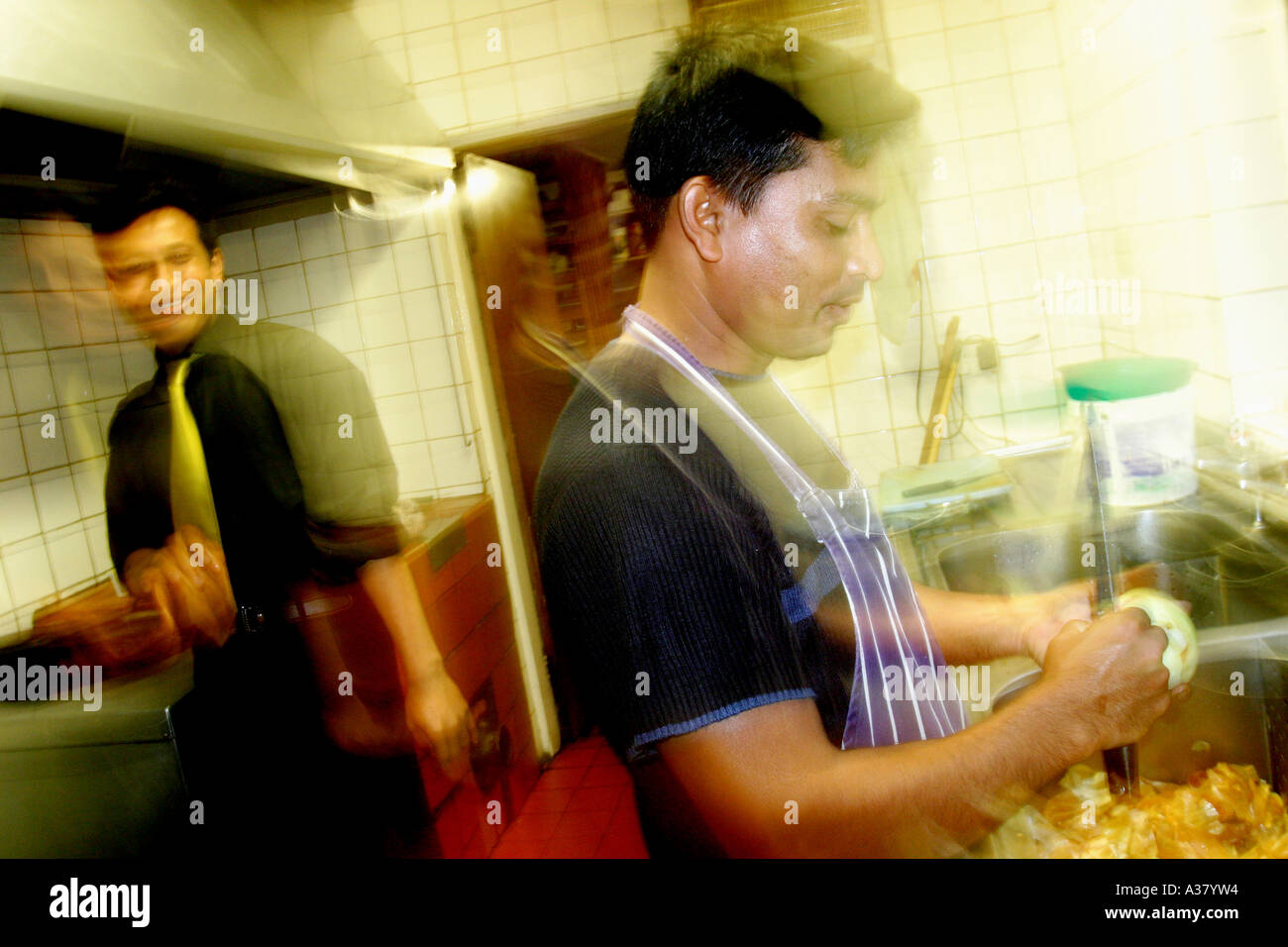 Preparing food in Indian restaurant kitchen Stock Photo - Alamy