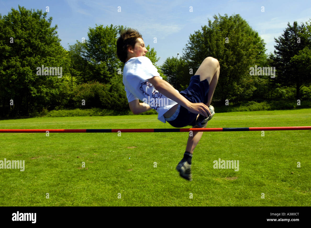 boy high jump jumper jumping summer school field sports day lad male ...