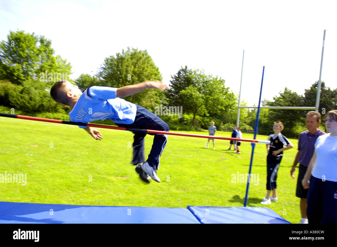 boy high jump jumper jumping summer school field sports day lad male ...