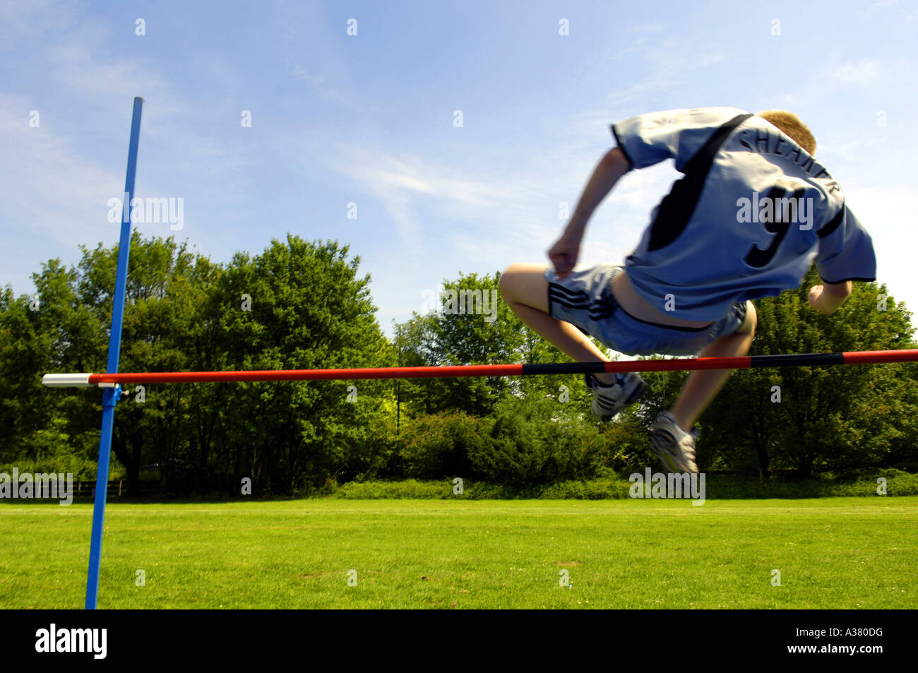 boy high jump jumper jumping summer school field sports day lad male ...