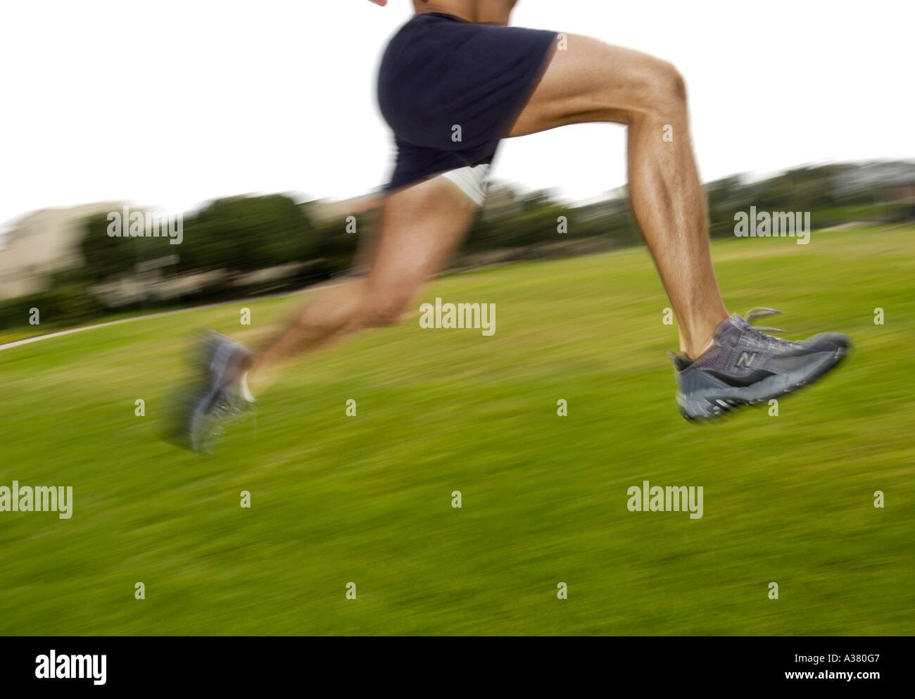 A man running in a park for exercise Stock Photo - Alamy