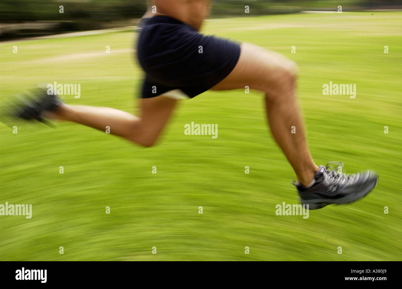 A man running in a park for exercise Stock Photo - Alamy
