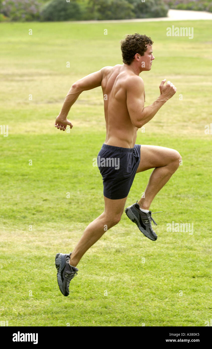 A man running in a park for exercise Stock Photo - Alamy