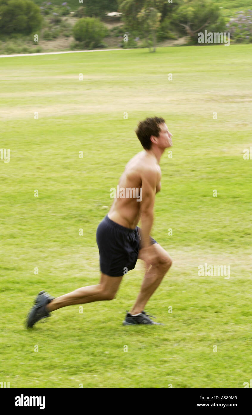 A man running in a park for exercise Stock Photo - Alamy
