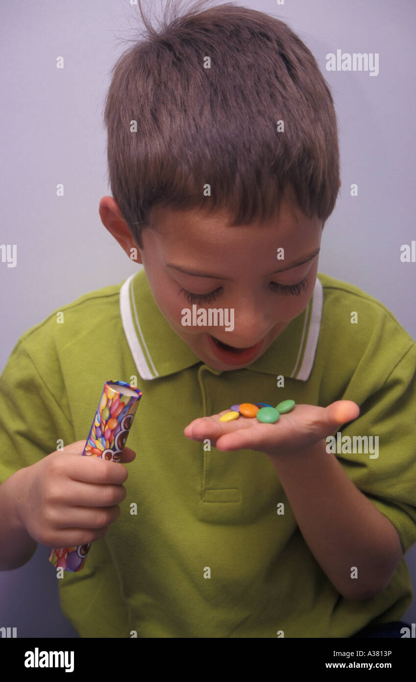 boy eating smarties Stock Photo - Alamy