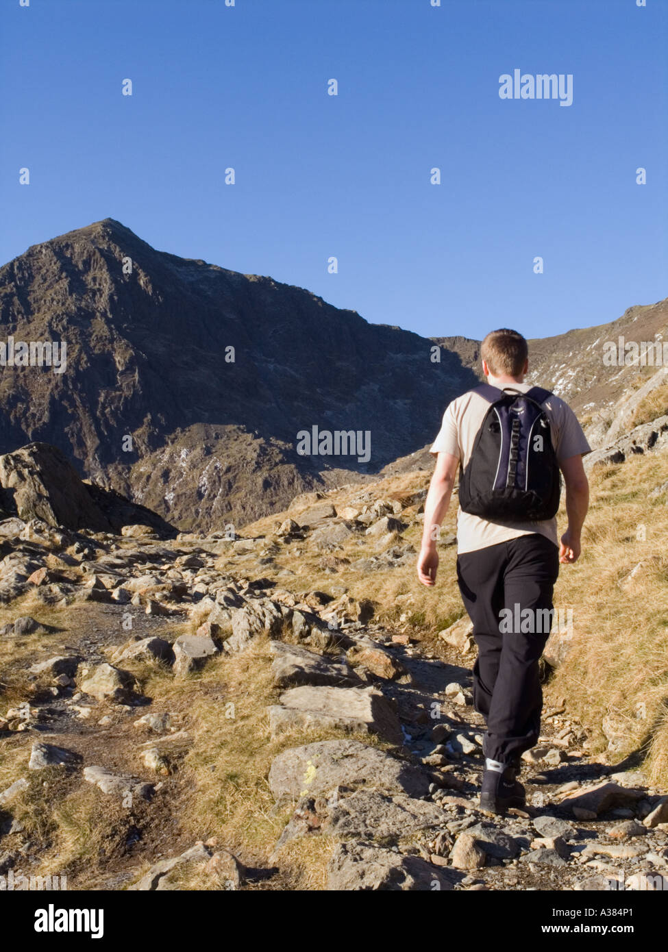 Man walking up mountain hi-res stock photography and images - Alamy