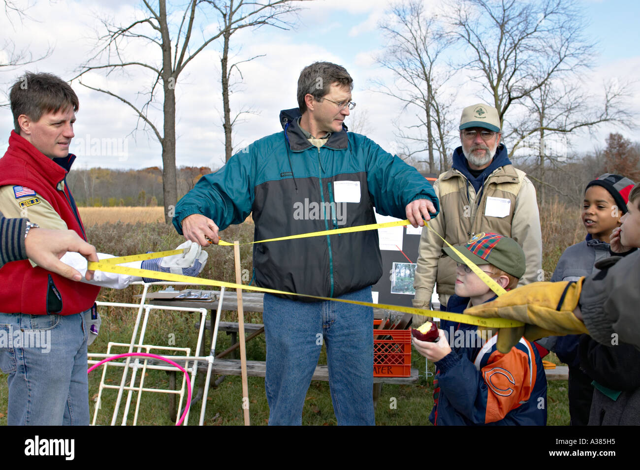 PRESERVES Vernon Hills Illinois Adult demonstrate how girth of tree is ...