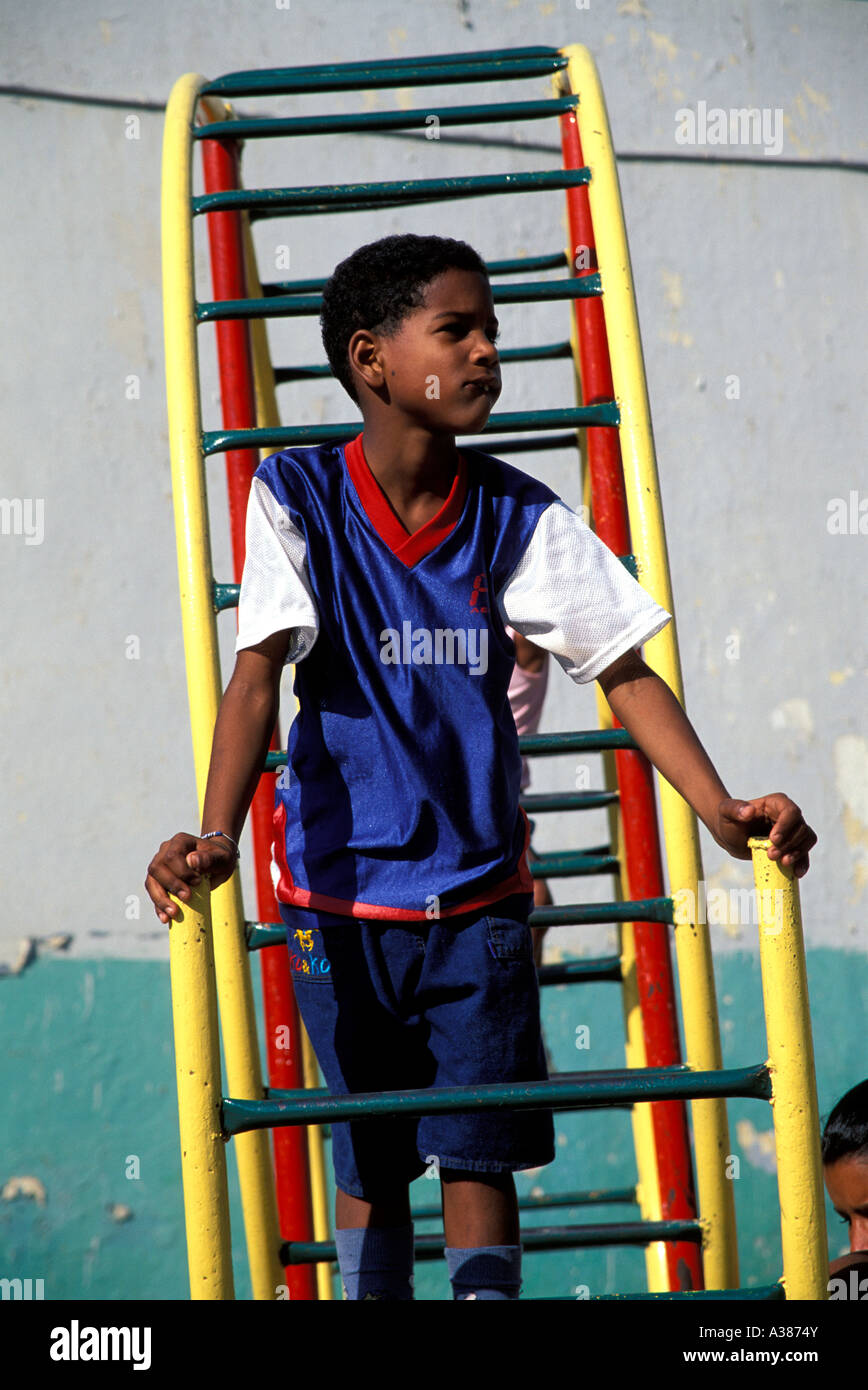 A Cuban boy plays on colorful monkey bars at a playground in Havana ...