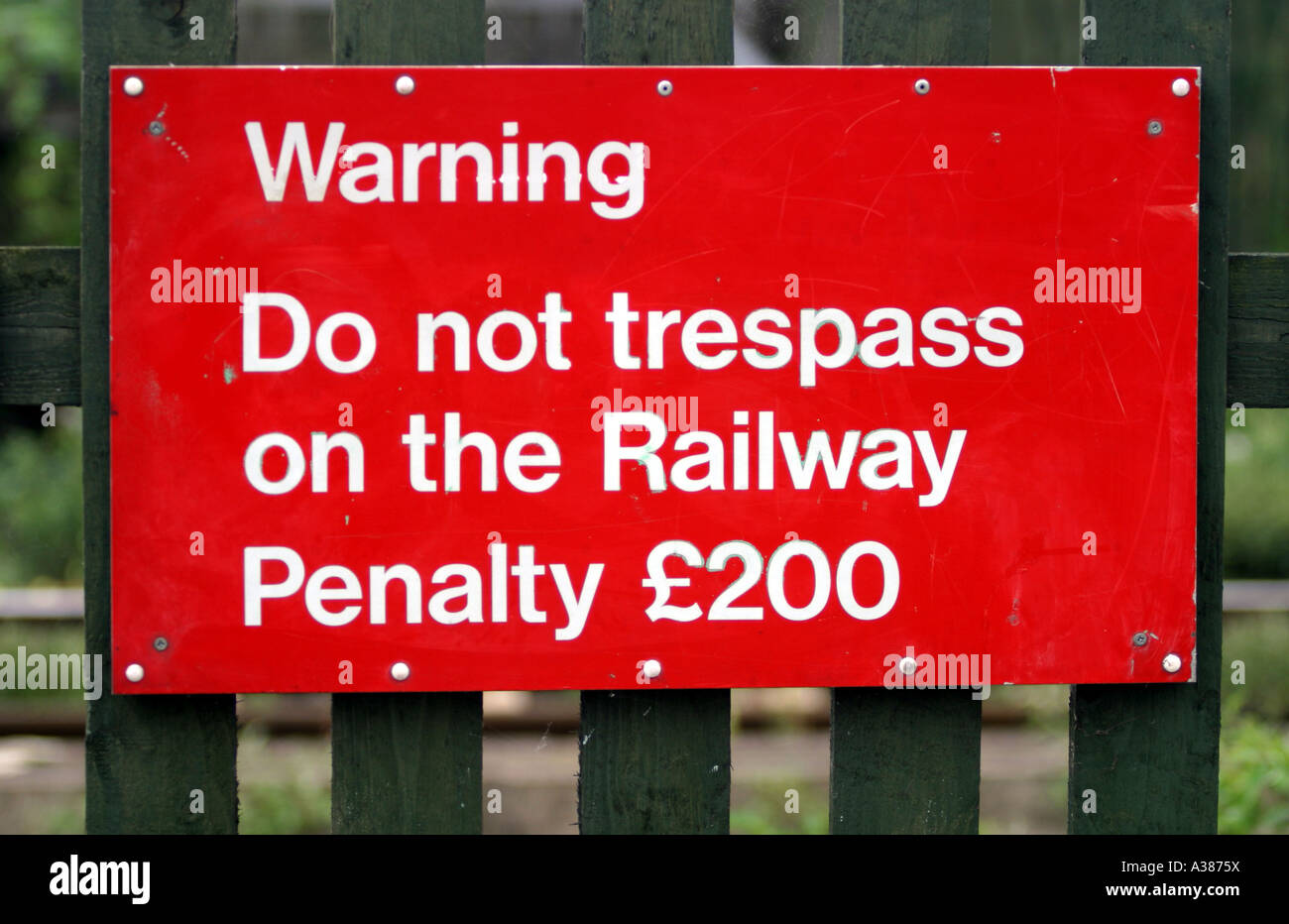 Warning sign railway fine information Stock Photo - Alamy