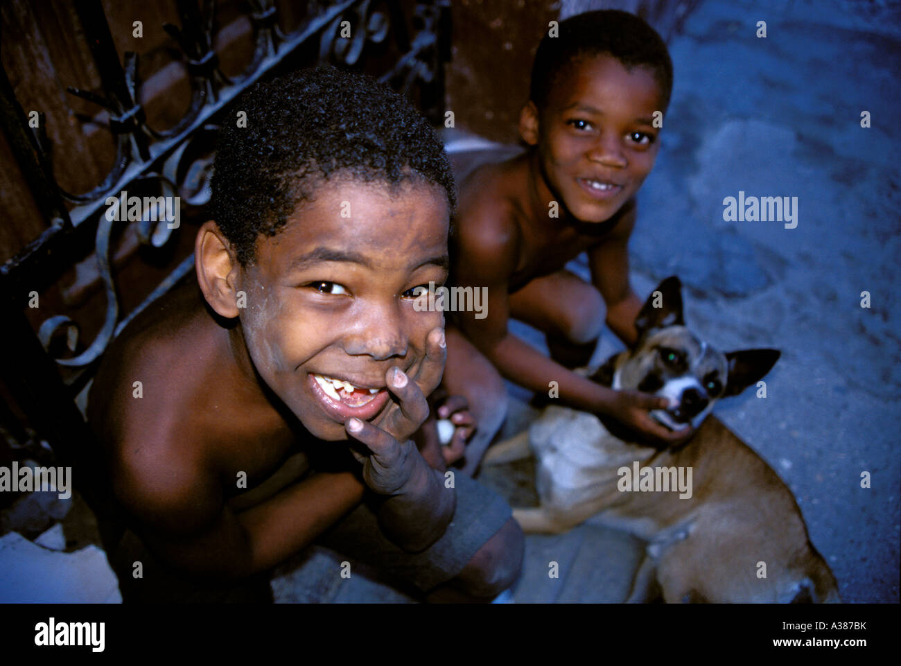 Two Cuban boys laugh as I tell them a joke Stock Photo - Alamy