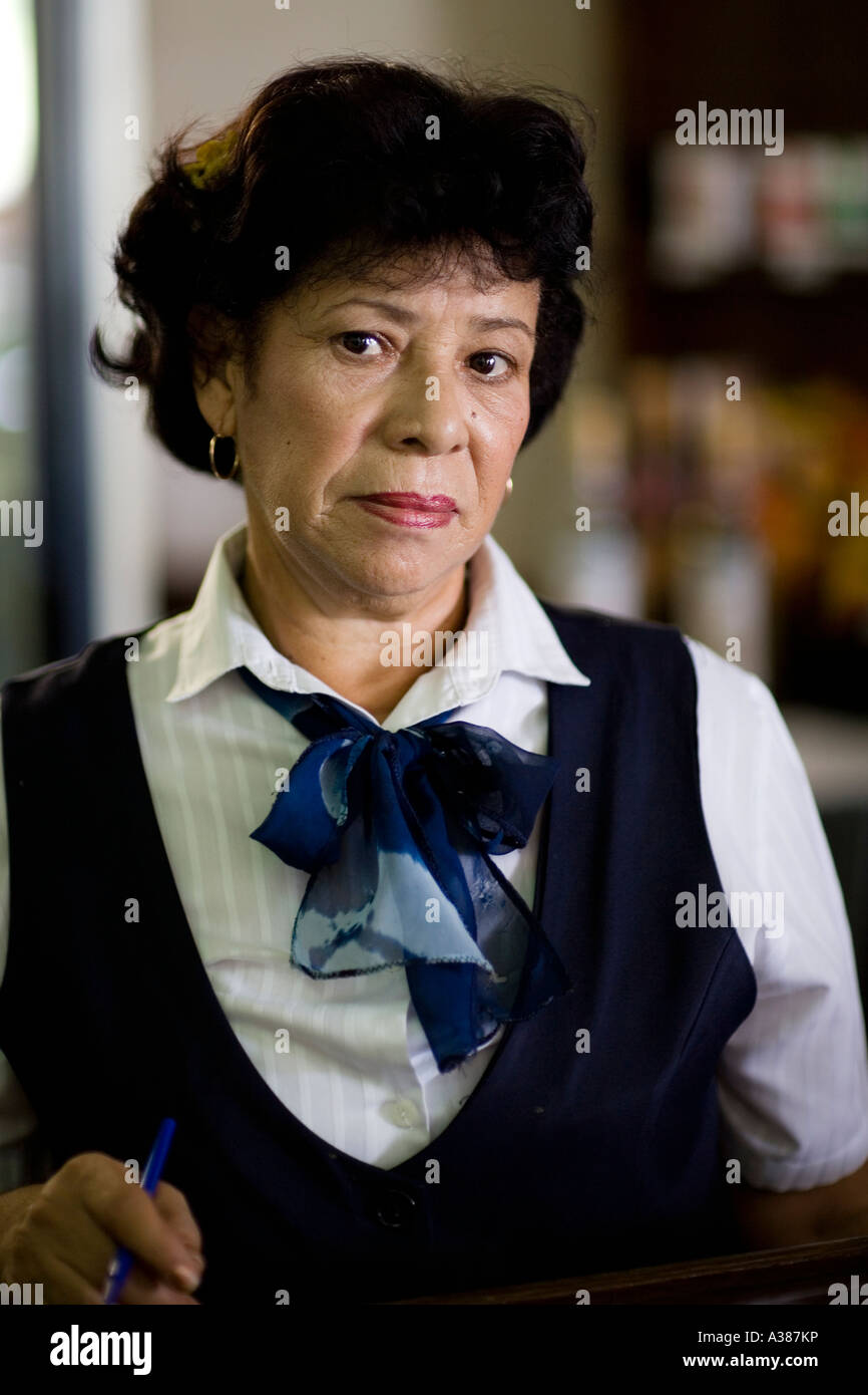 A barmaid works the bar at a hotel in Santiago Stock Photo - Alamy