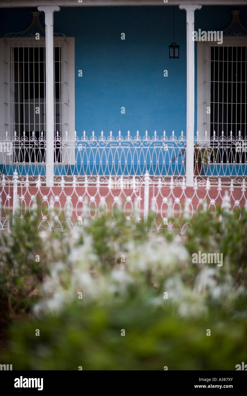 A garden and a porch of a colonial house is seen in Trinidad Stock ...
