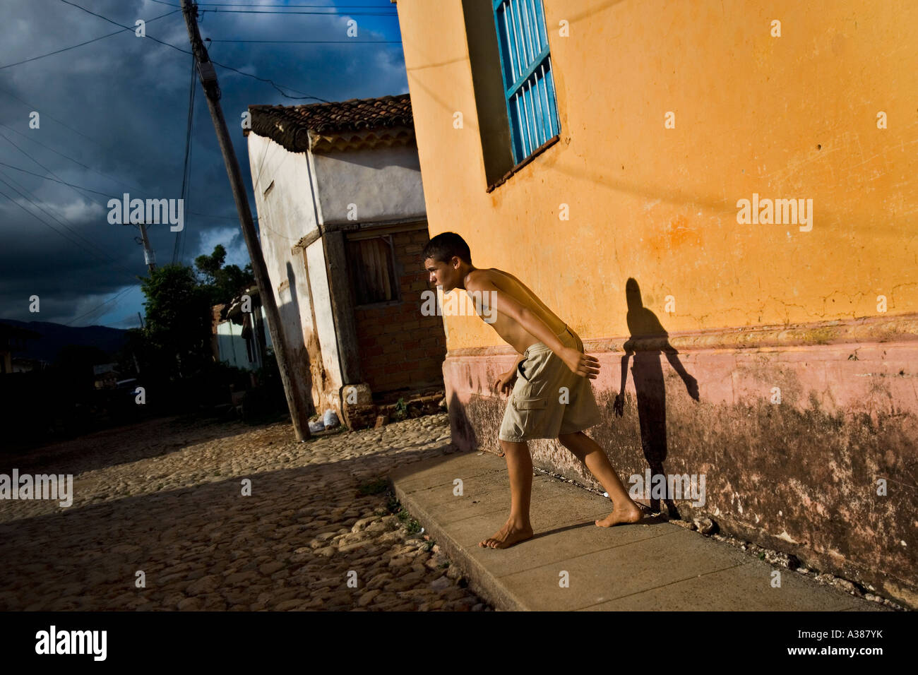 Cuban boy playing street baseball Stock Photo - Alamy