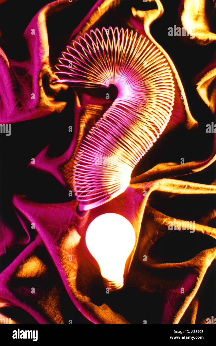 Question mark made of spring and light bulb Stock Photo - Alamy