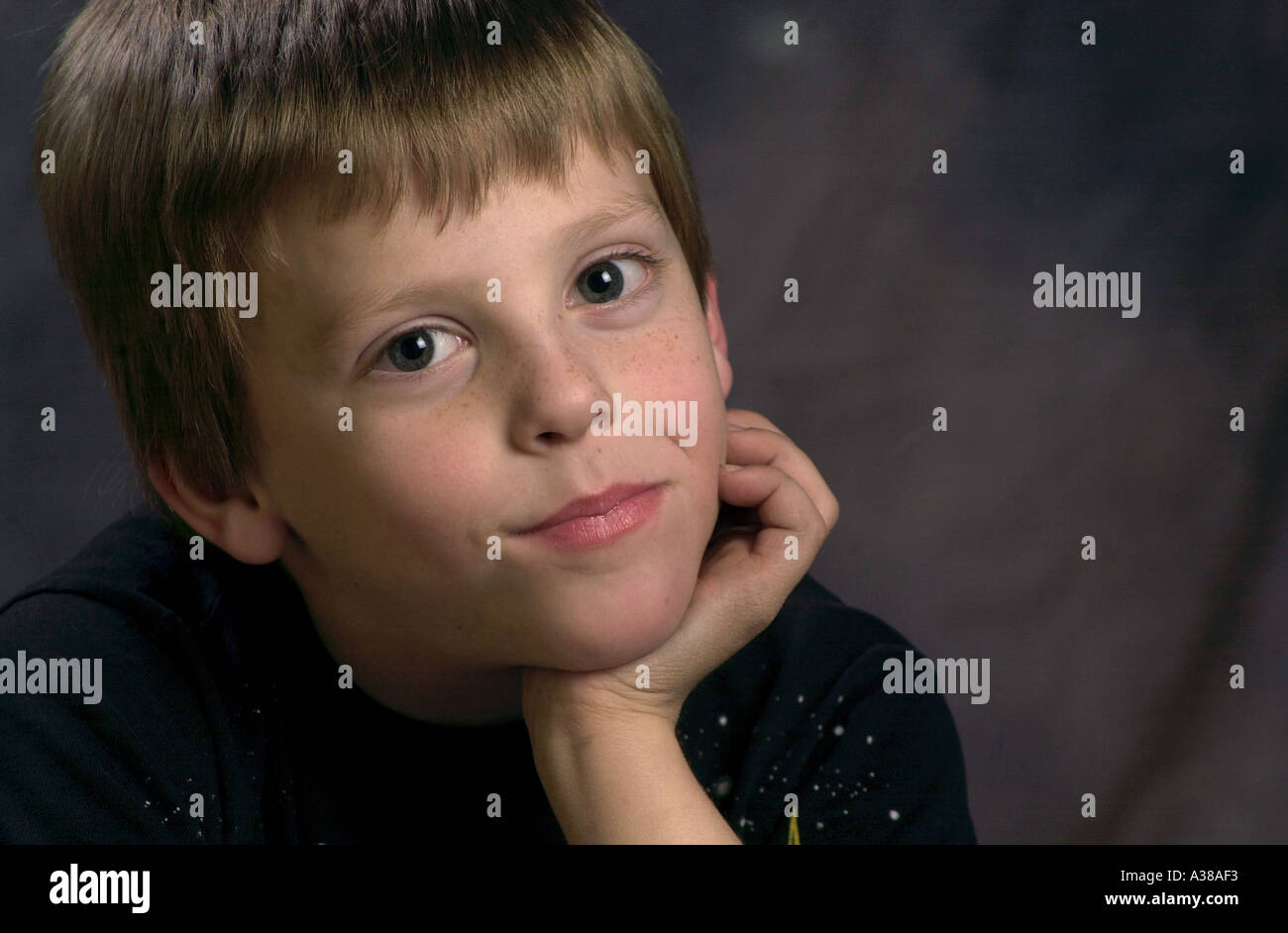 sincere young boy studio background Stock Photo - Alamy